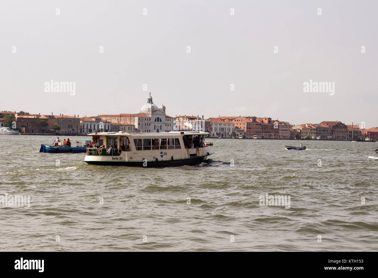 View of water boat bus on canal with historical buildings in the ...