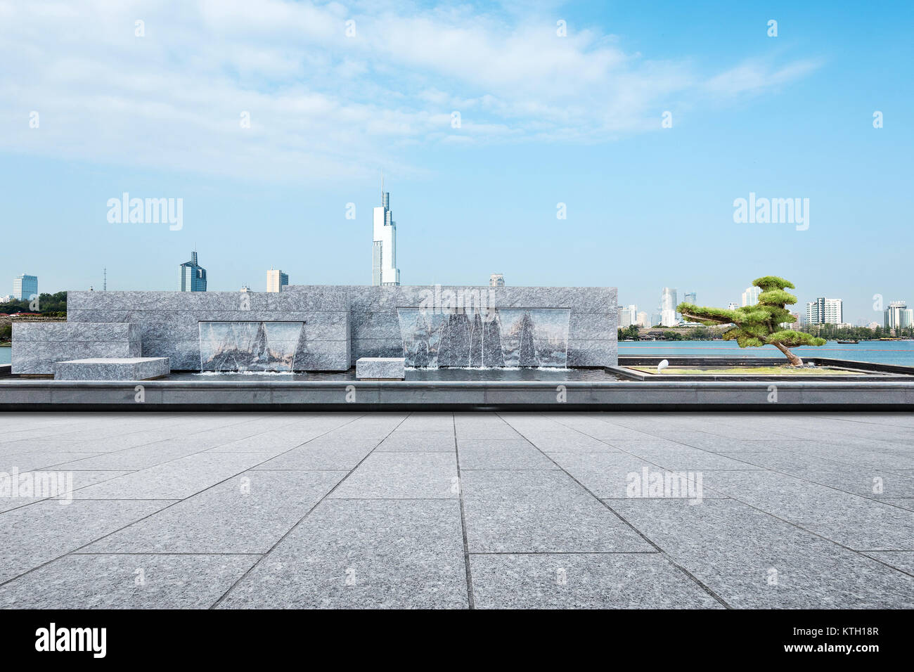 empty marble square with artificial waterfall in blue cloud sky Stock ...
