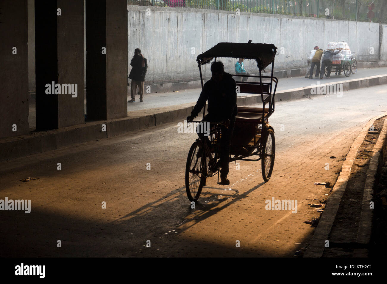 Cycle rickshaw enters underpass in New Delhi, India Stock Photo - Alamy