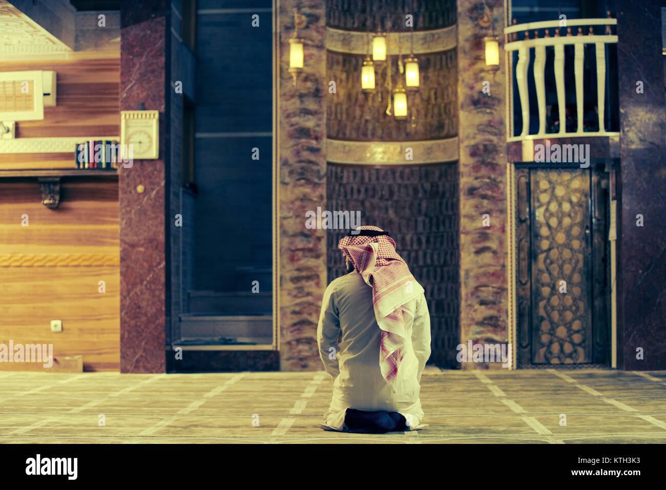 Religious muslim man praying inside the mosque Stock Photo - Alamy