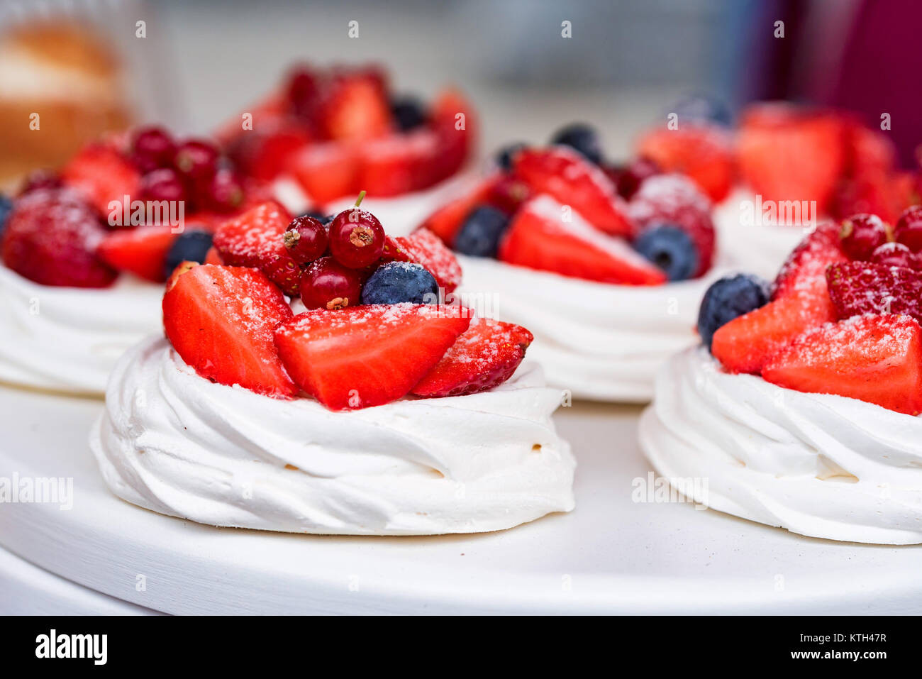 Meringue pastries with berries and fruits Stock Photo - Alamy