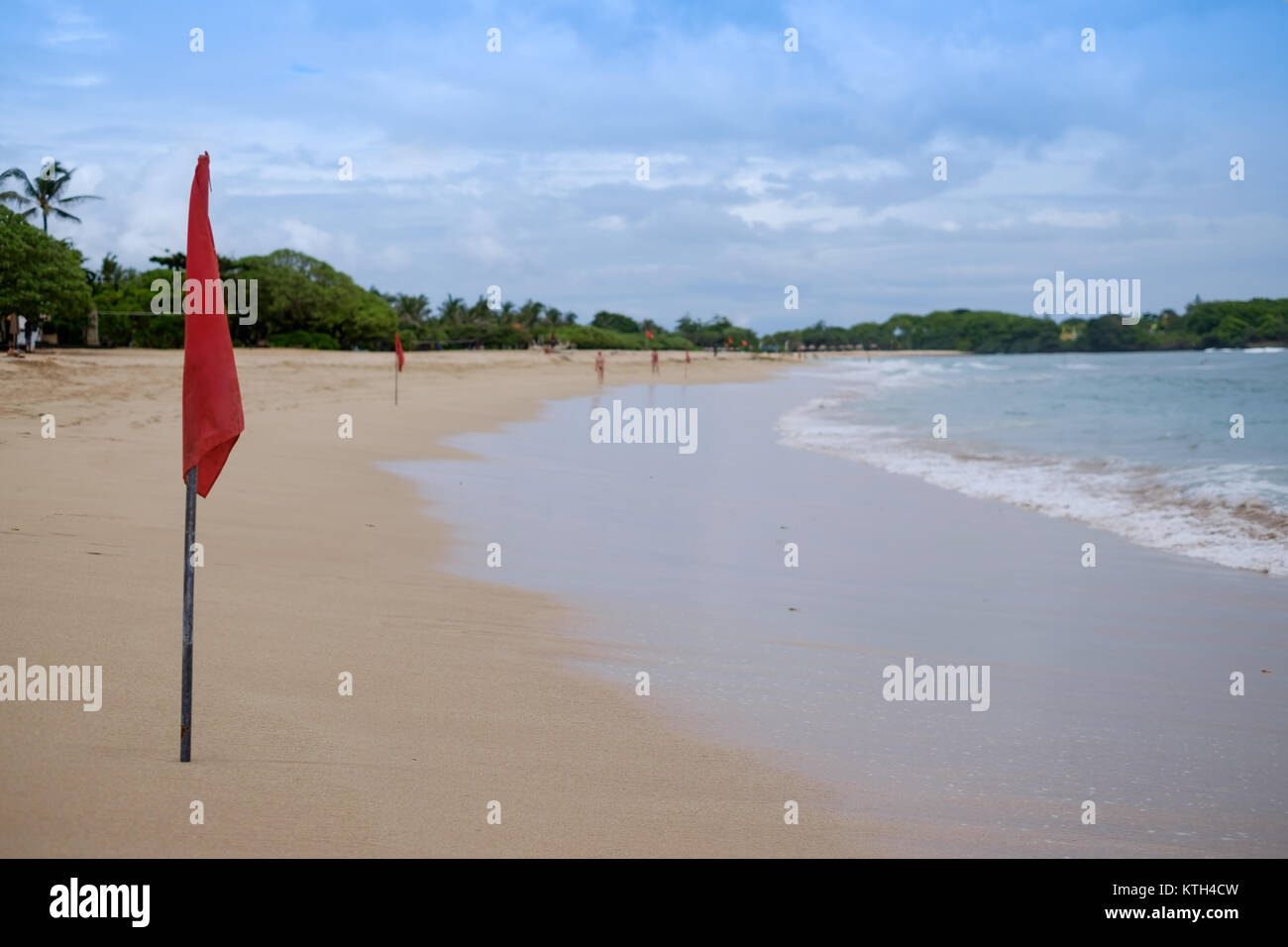 A red warning flag on the beach in the Nuca Dua Bali, Indonesia. Danger ...