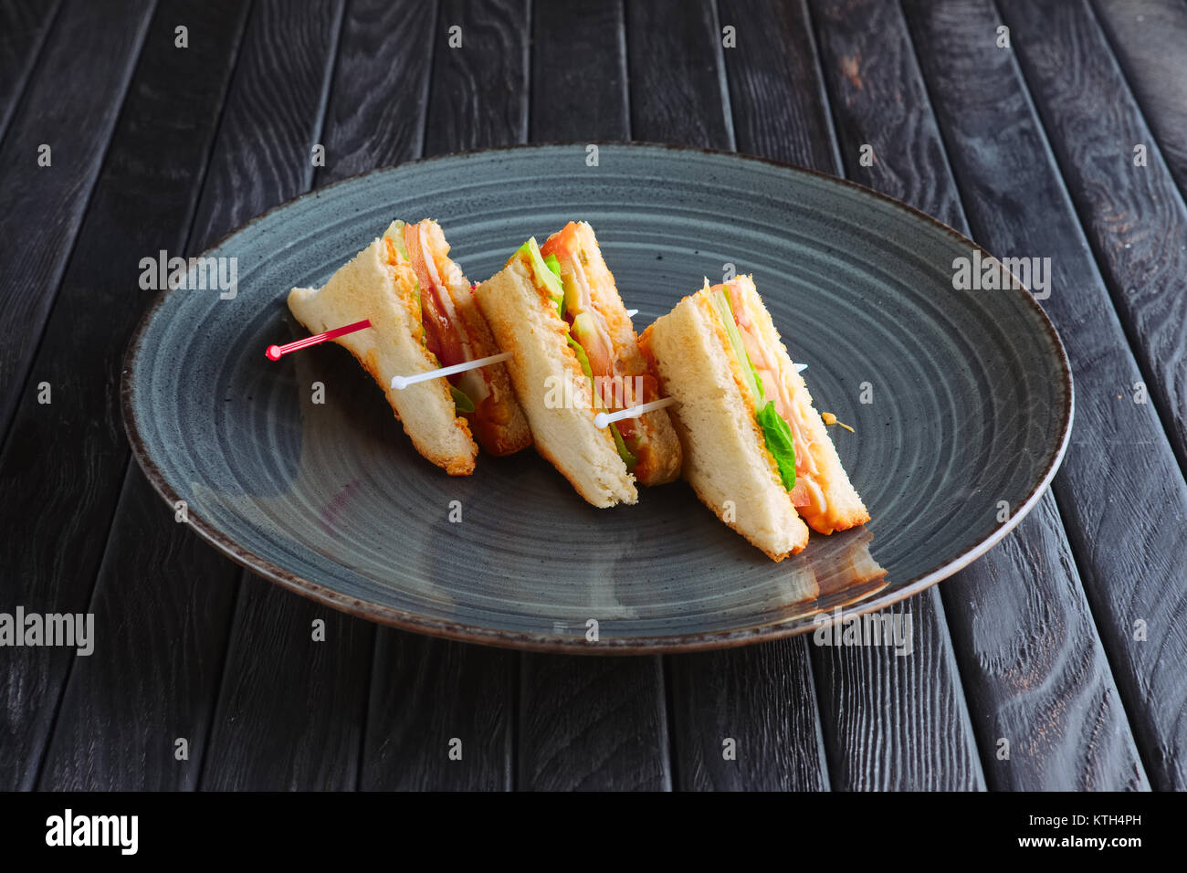 Appetizer for reception. Three mini club sandwich on plate Stock Photo ...