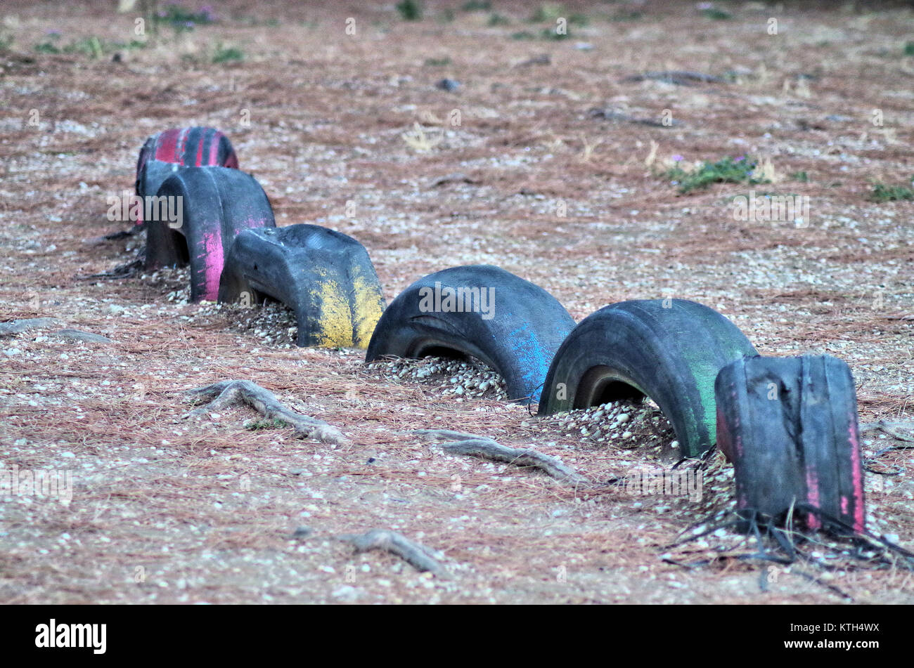 a bunch of colored tyres spreaded on the ground Stock Photo - Alamy