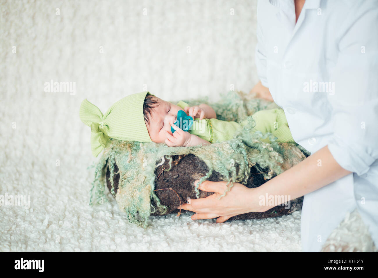 Mom putting baby to sleep Stock Photo - Alamy