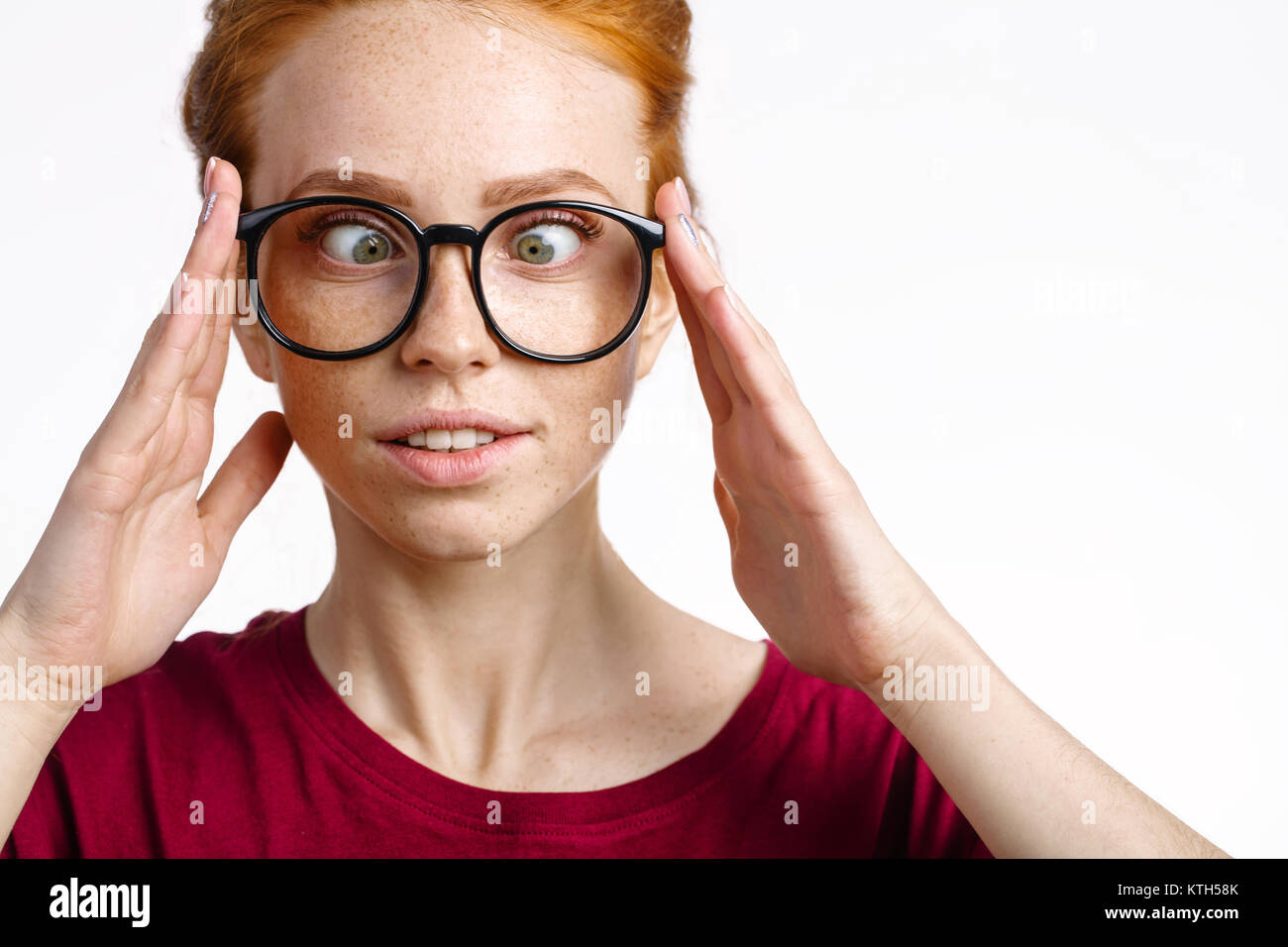 Silly woman smiling face and squinting eyes and touching glasses Stock ...
