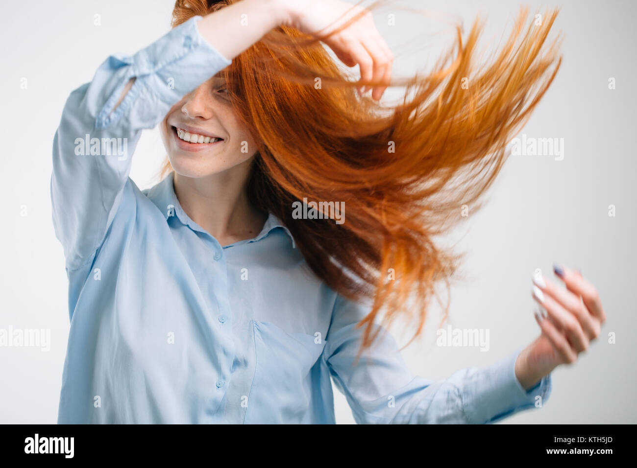 Portrait of beautiful cheerful redhead girl with flying hair smiling laughing Stock Photo - Alamy