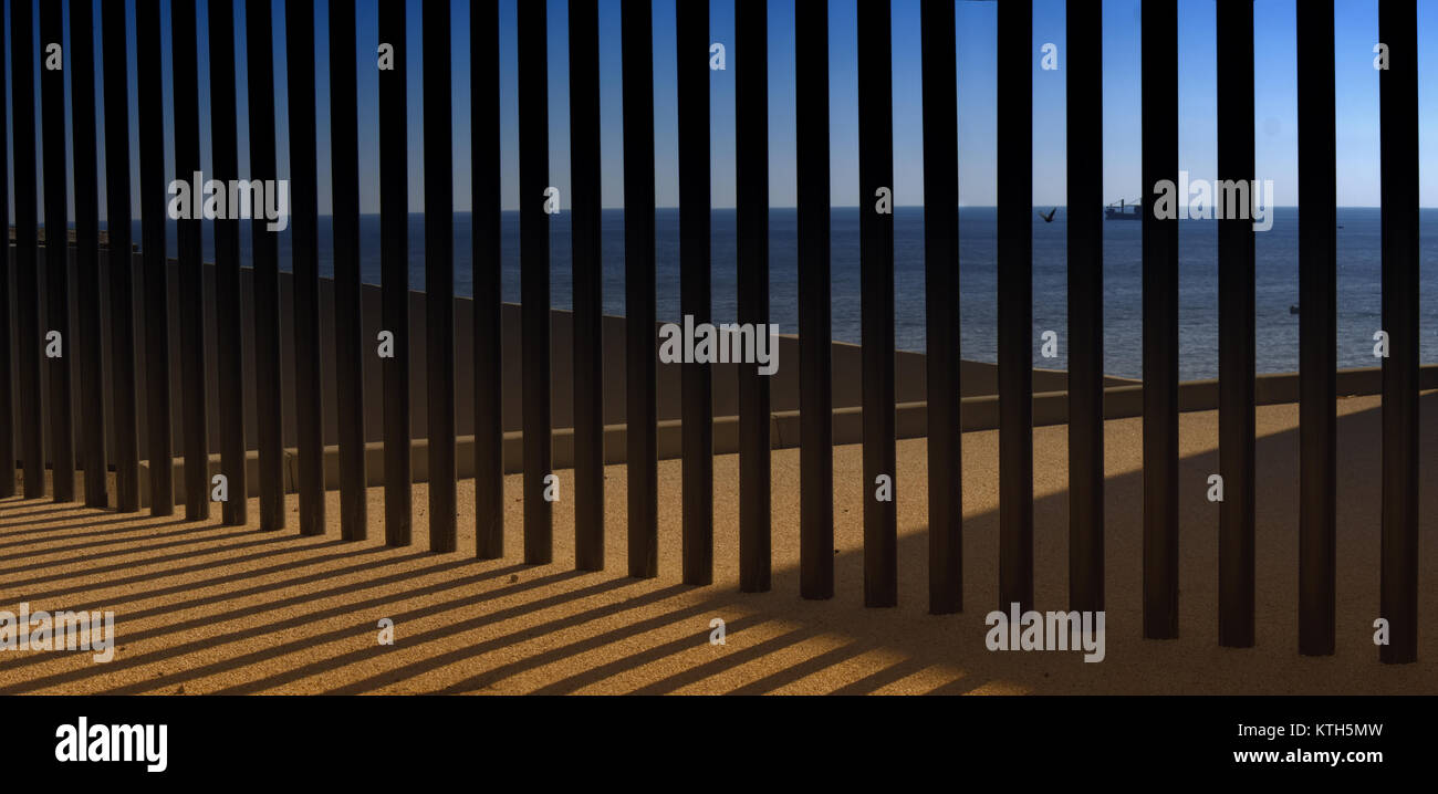 Fence by the ocean Stock Photo - Alamy