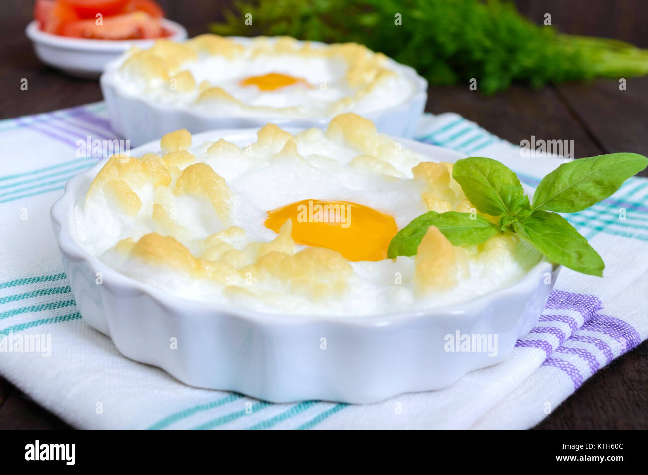 Delicate baked egg Orsini (eggs in the cloud). French breakfast Stock ...