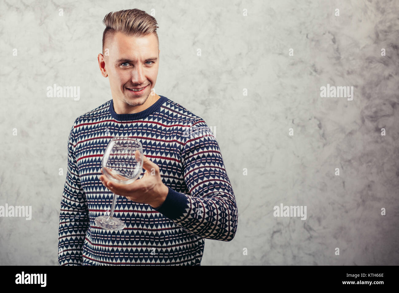 man holding empty wine glass Stock Photo - Alamy