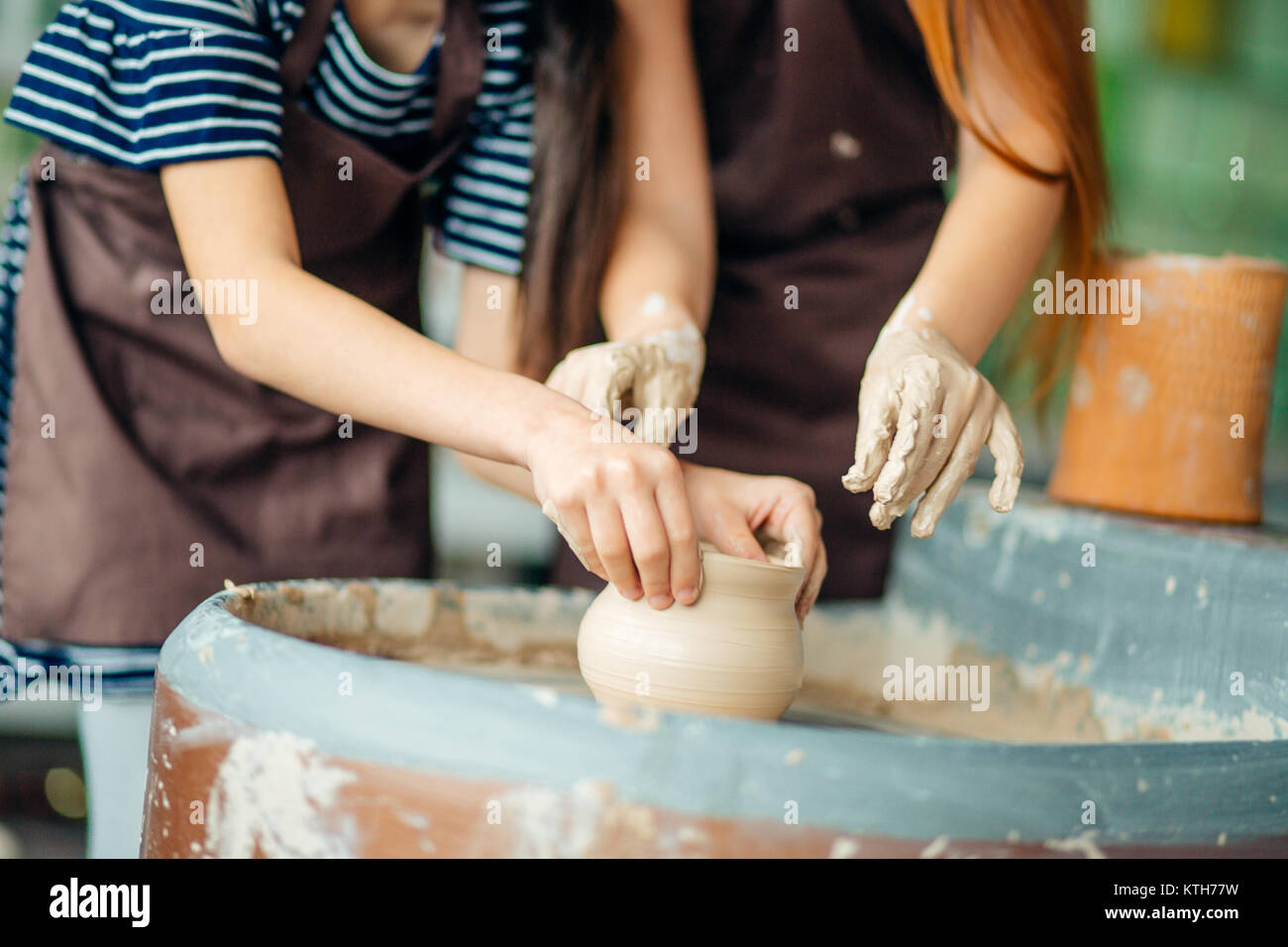 Hands of young potter, close up hands made cup on pottery wheel Stock ...