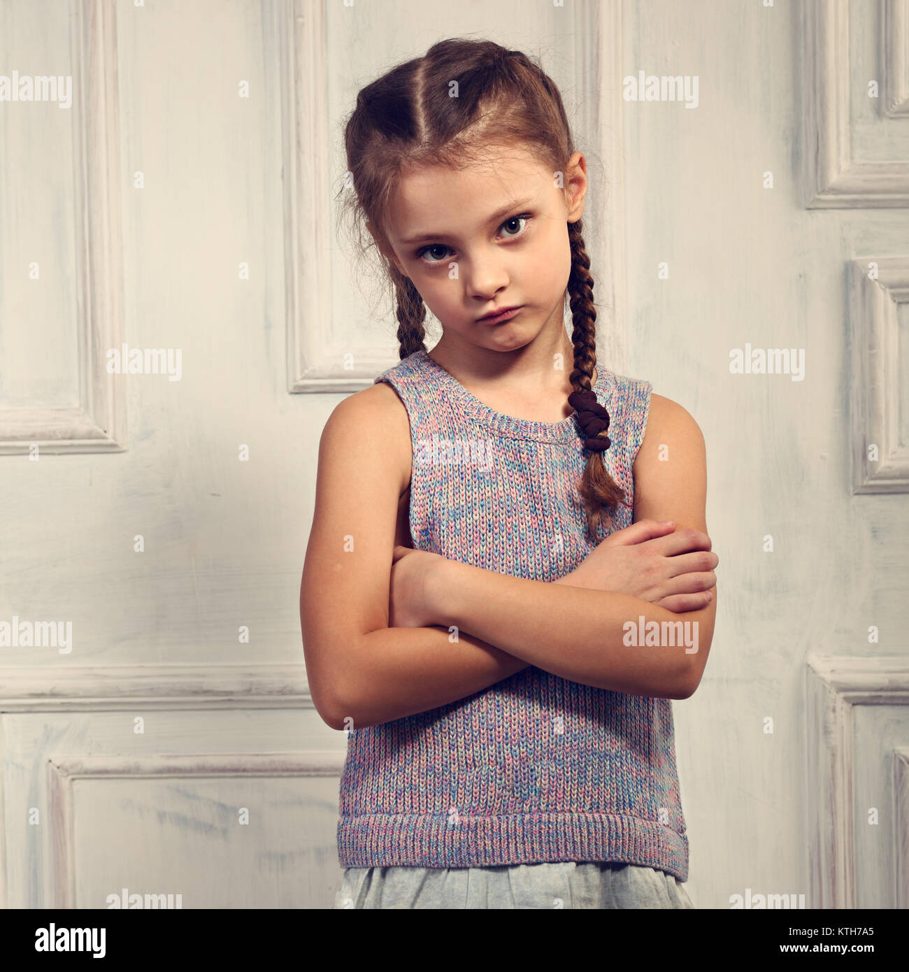 Child with arms folded unhappy hi-res stock photography and images - Alamy
