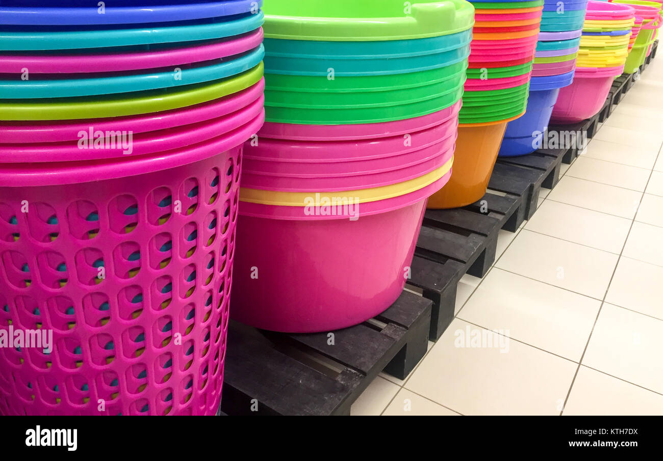 Stacks of colorful laundry buckets on display for sale at department ...