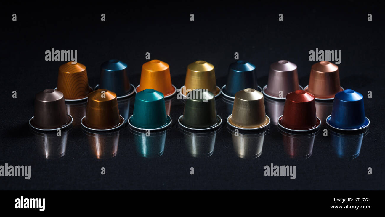 Collection of espresso coffee capsules isolated on black background ...