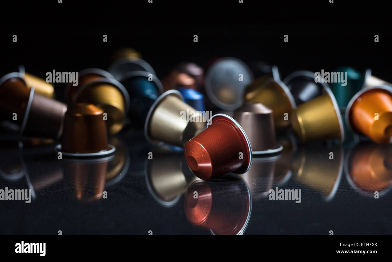 Collection of espresso coffee capsules on black background, Closeup ...
