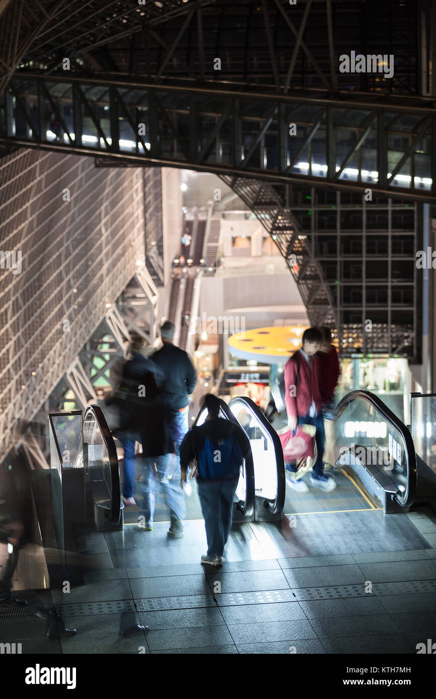 People run escalator in Japanese shopping center of Kyoto railway ...
