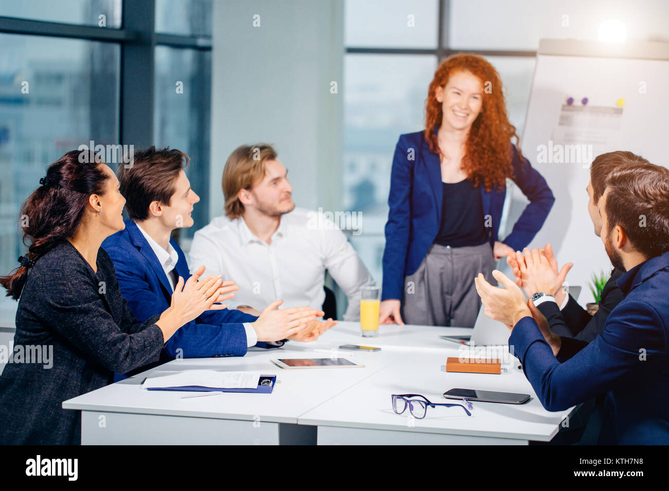 Business woman giving presentation to colleagues in office Stock Photo ...
