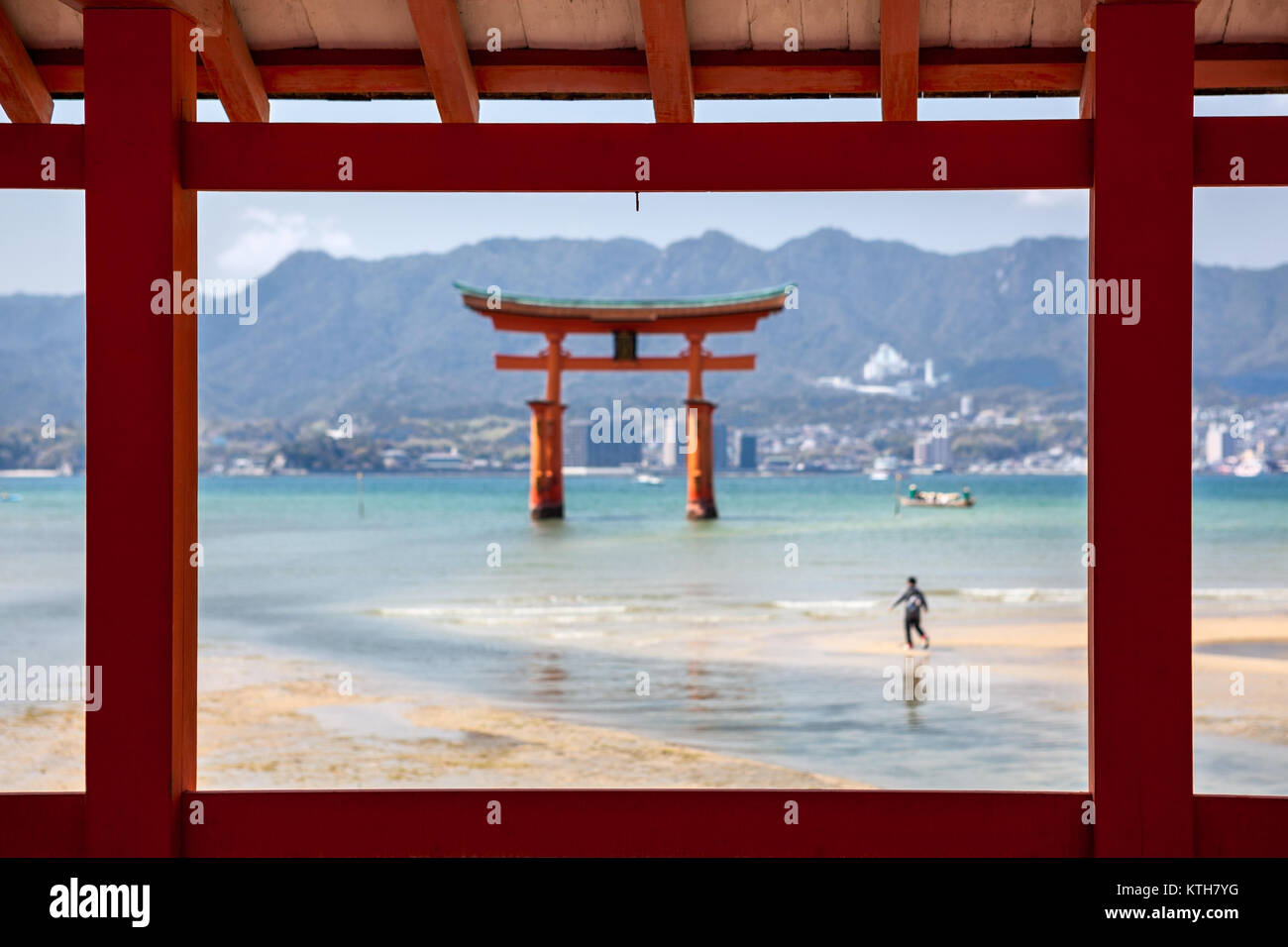 View through wooden constructions at the torii gate of Itsukushima ...