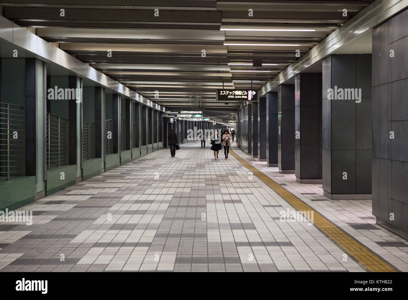 TOKYO, JAPAN-CIRCA APR 2013: People walk in pedestrian undercrossing at ...