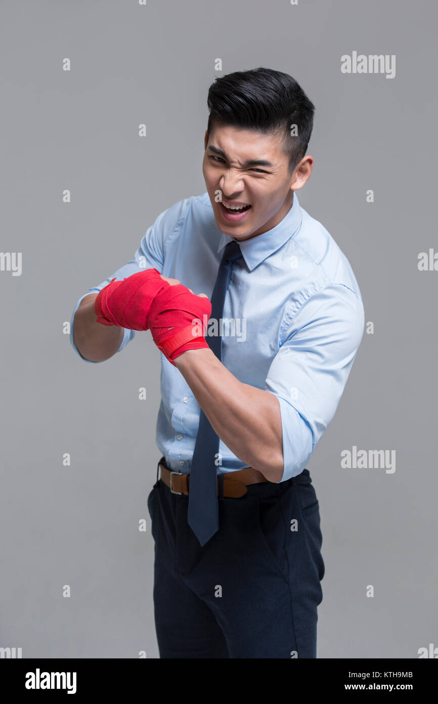 Young businessman boxing Stock Photo - Alamy