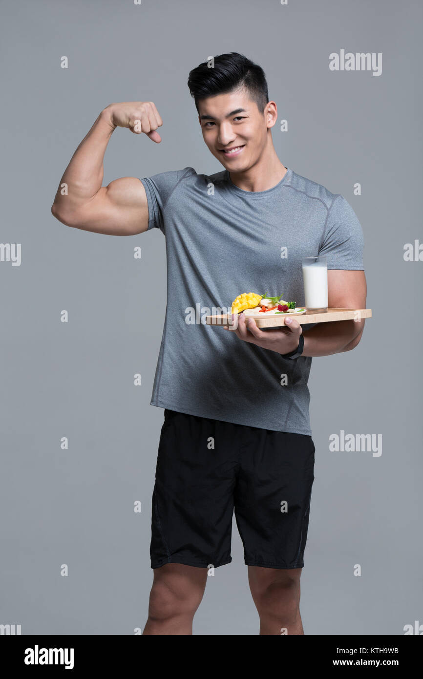 Male flexing bicep muscles hi-res stock photography and images - Alamy