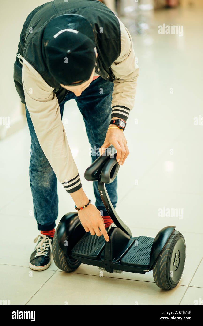 man activate electric segway at mall, active man using modern transport ...