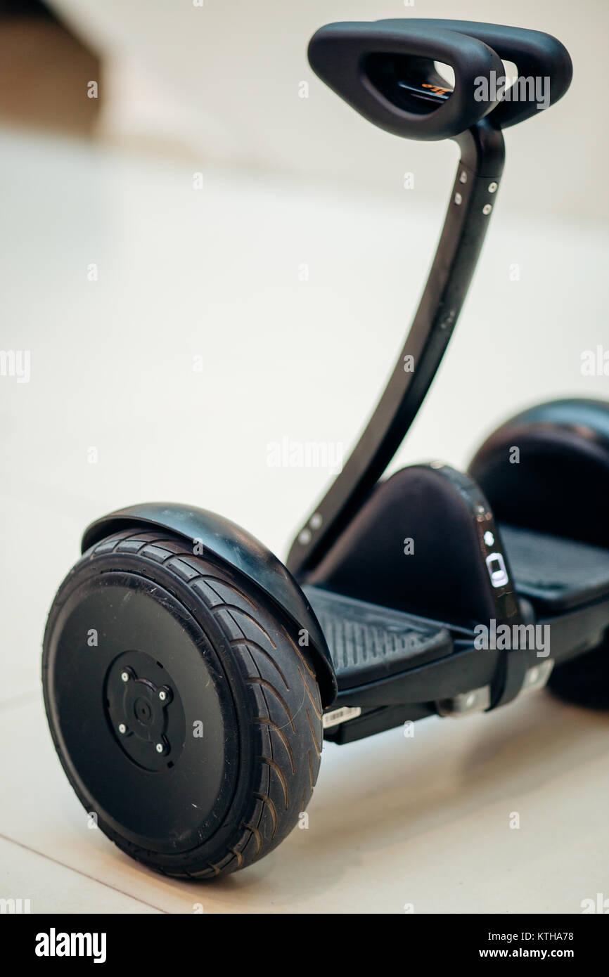 Segway on parquet. electric scooter. black gyrometer Stock Photo - Alamy