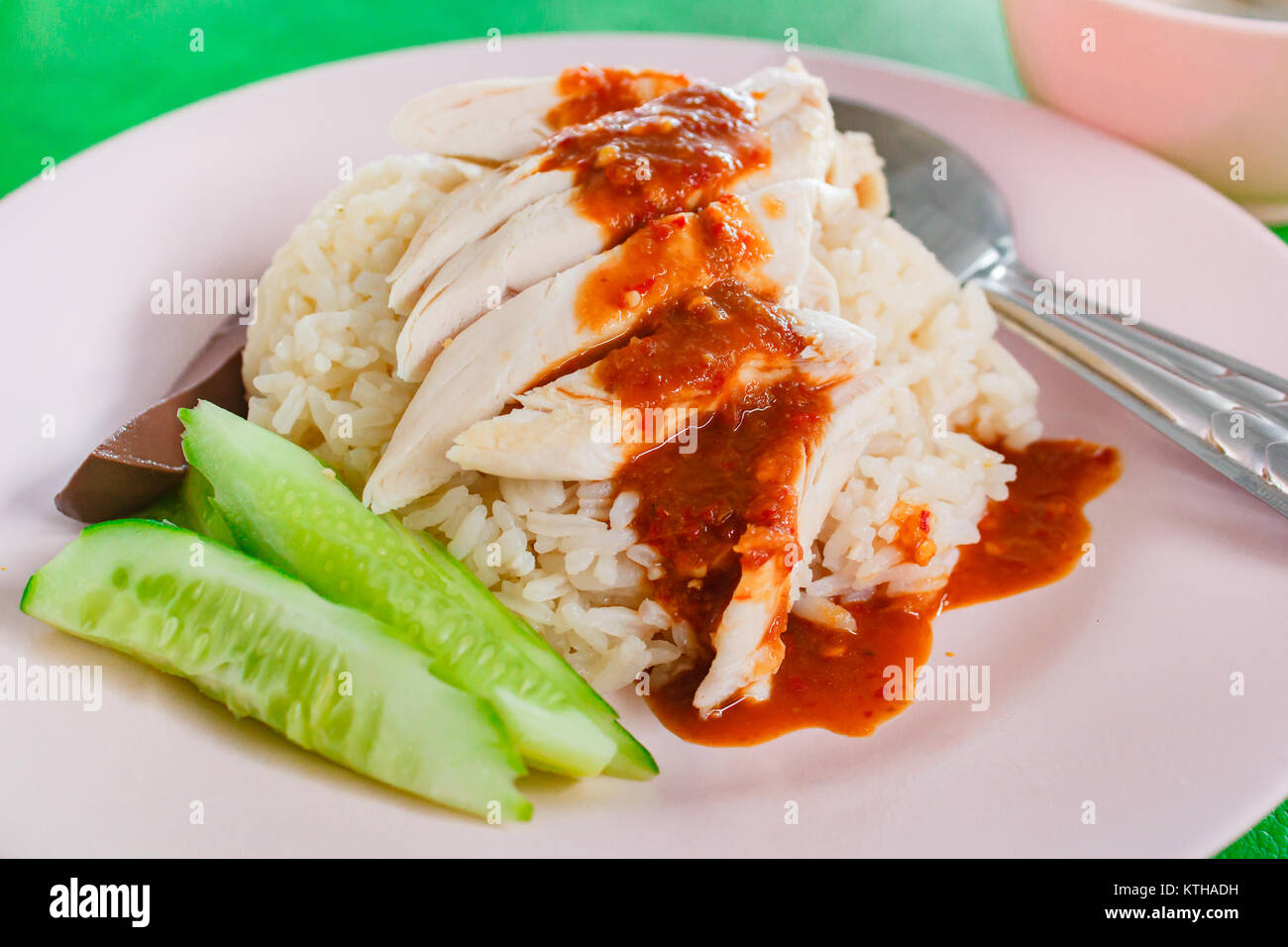 Hainanese chicken rice, steamed chicken with rice and sauce Stock Photo ...