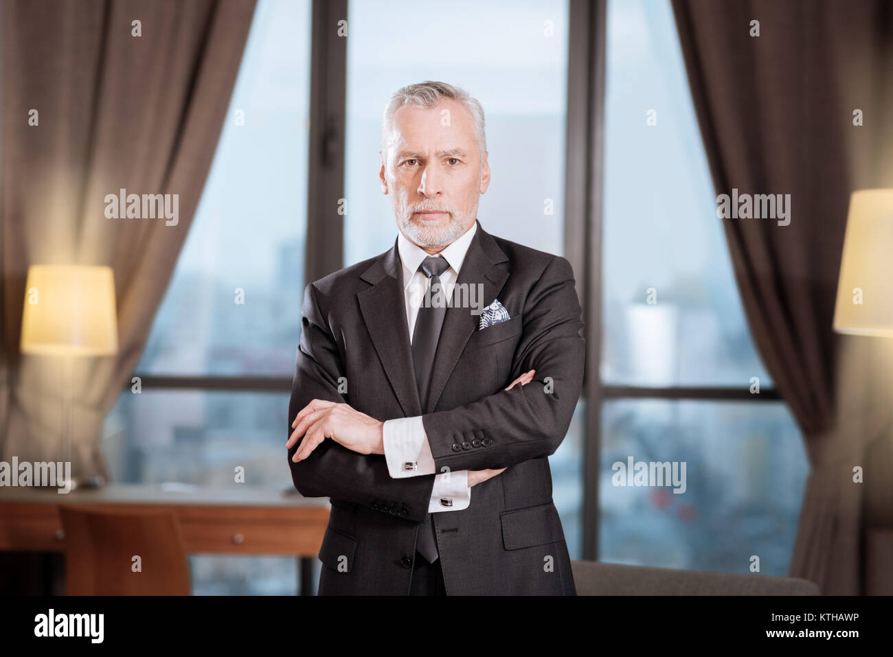 Concentrated senior man deciding your destiny Stock Photo - Alamy