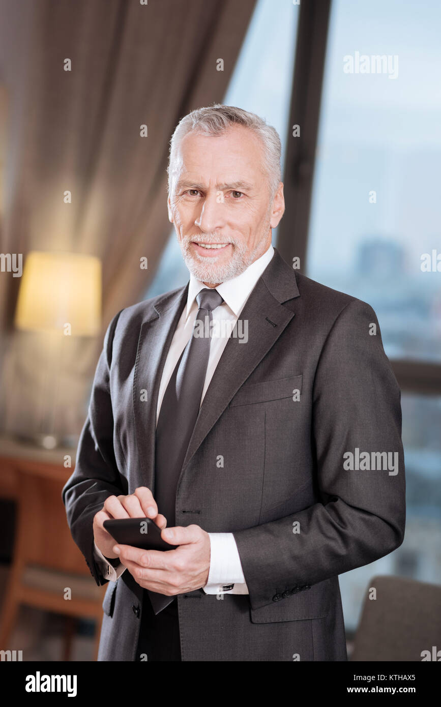 Energetic senior man dialing number Stock Photo - Alamy