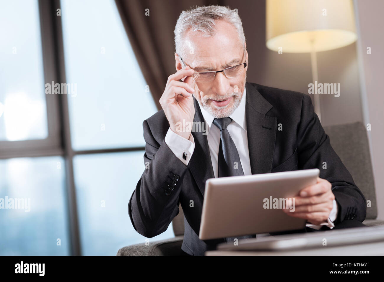 Concentrated senior man working on project Stock Photo - Alamy
