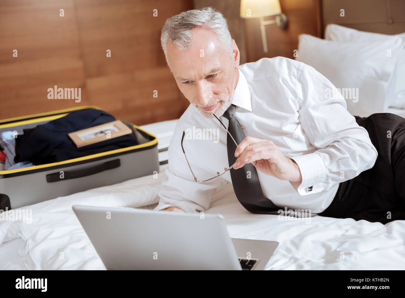Satisfied senior man staring at screen Stock Photo - Alamy