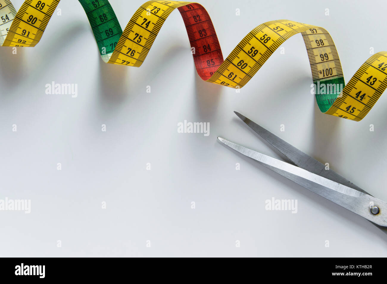 Isolated sewing meter and scissors on white background with space for ...