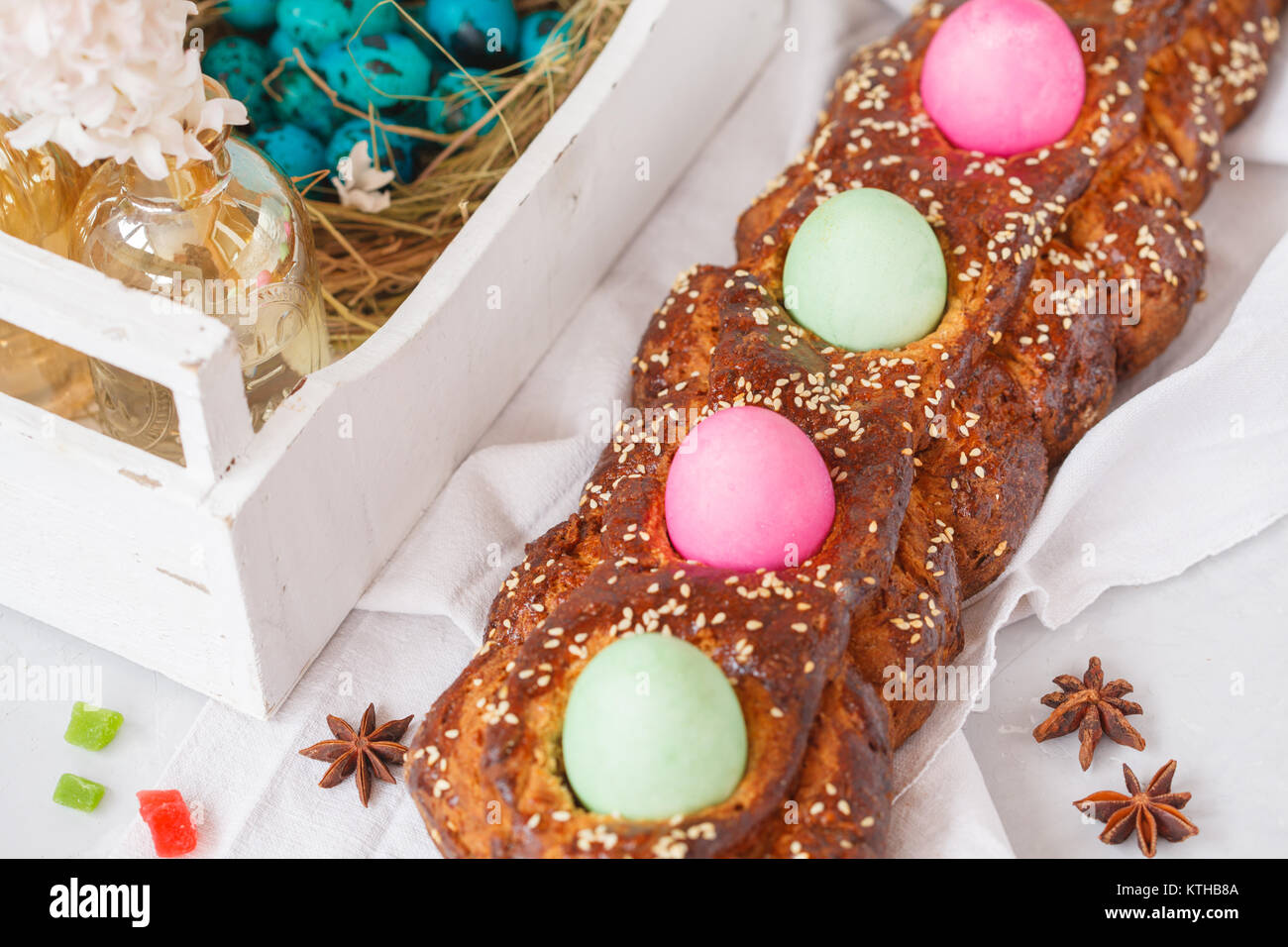 Traditional Greek Easter bread - tsoureki in Easter decorations with ...