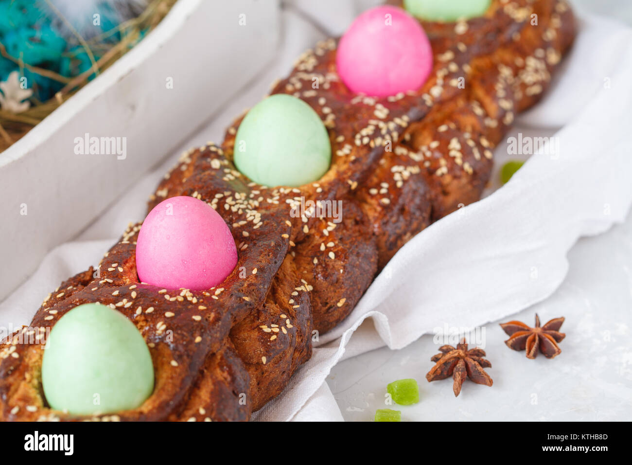 Traditional Greek Easter bread - tsoureki in Easter decorations with ...