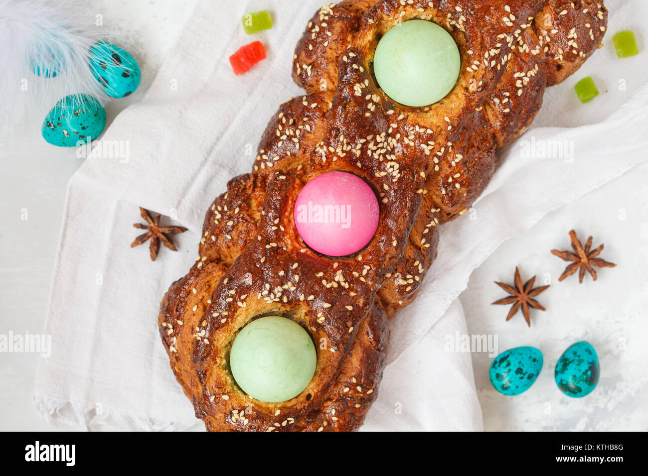 Traditional Greek Easter bread - tsoureki in Easter decorations with ...
