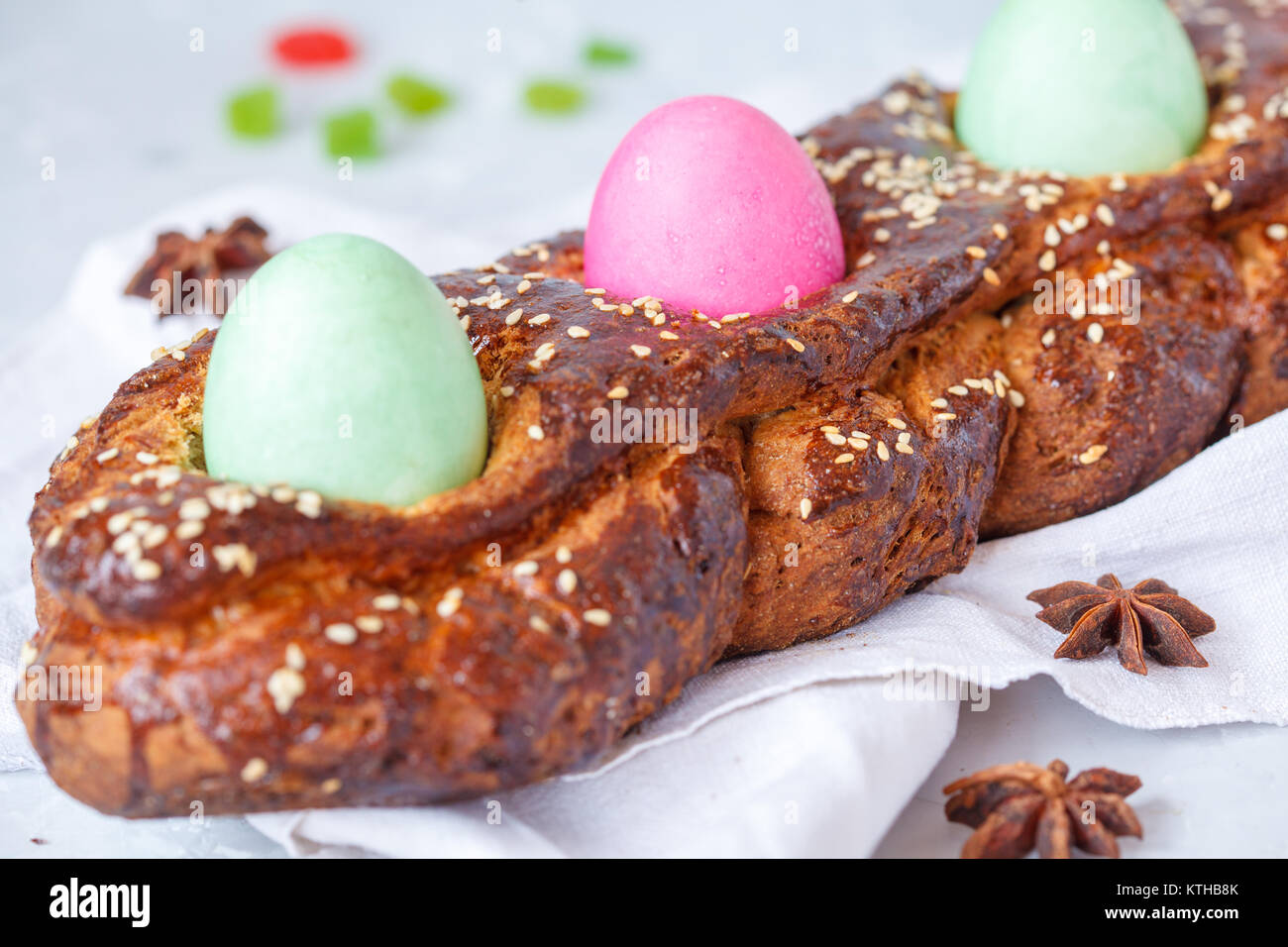 Traditional Greek Easter bread - tsoureki in Easter decorations with ...