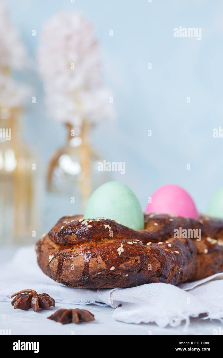 Traditional Greek Easter bread - tsoureki in Easter decorations with ...