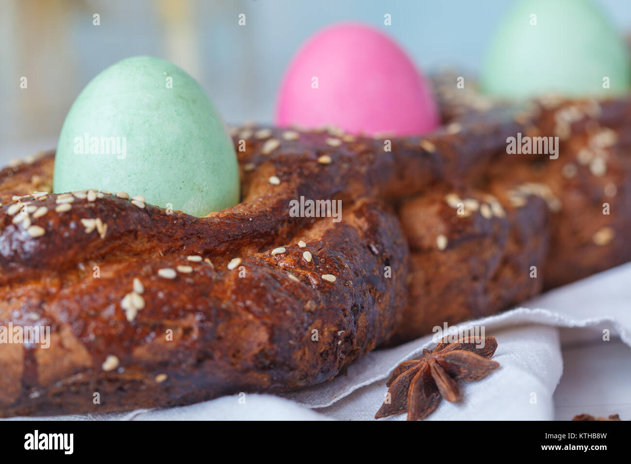 Traditional Greek Easter bread - tsoureki in Easter decorations with ...