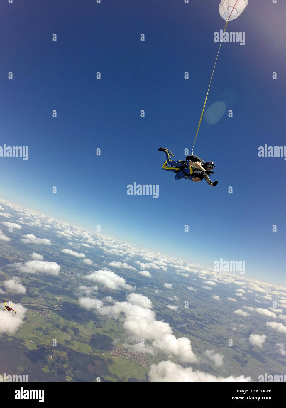 This tandem skydiving team is enjoying the scenic flight over a ...