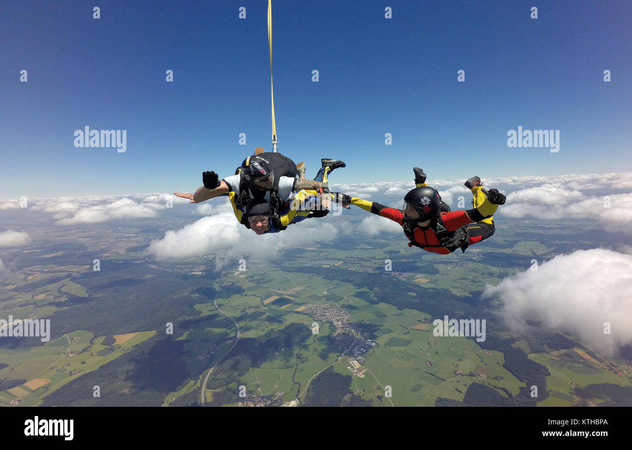 This tandem skydiving couple, plus the fun jumper are enjoying the ...