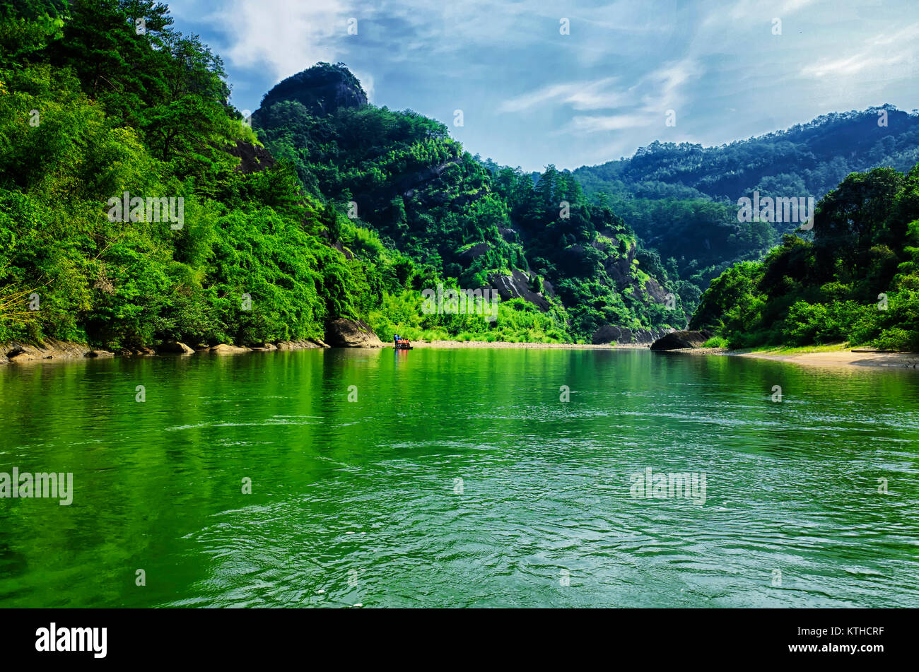 Rock formations lining the nine bend river or Jiuxi in Wuyishan or ...