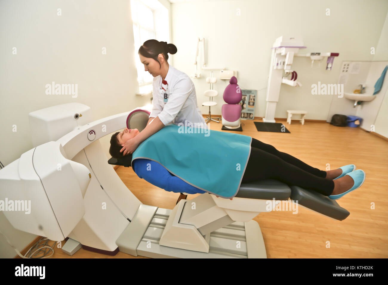 Close up head shot of girl taking dental tac with cephalometric ...