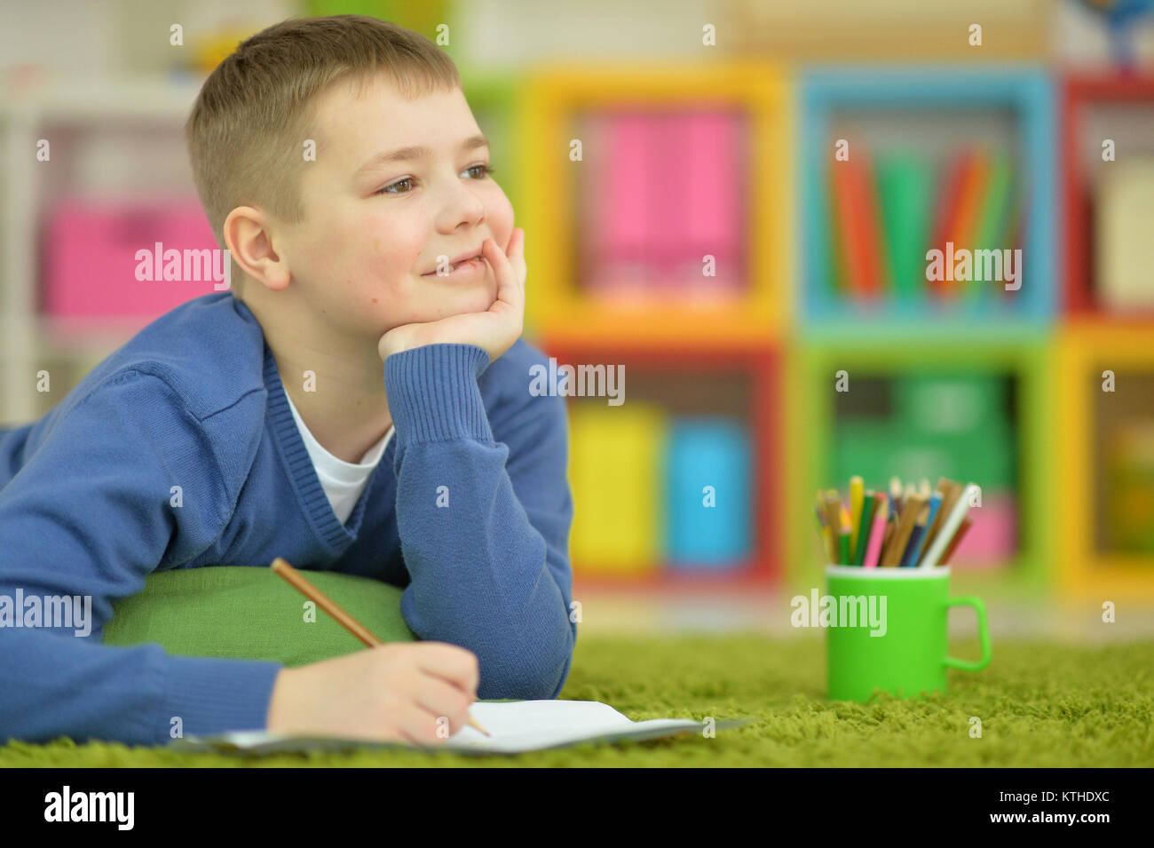 Portrait of a boy drawing with pencil Stock Photo - Alamy