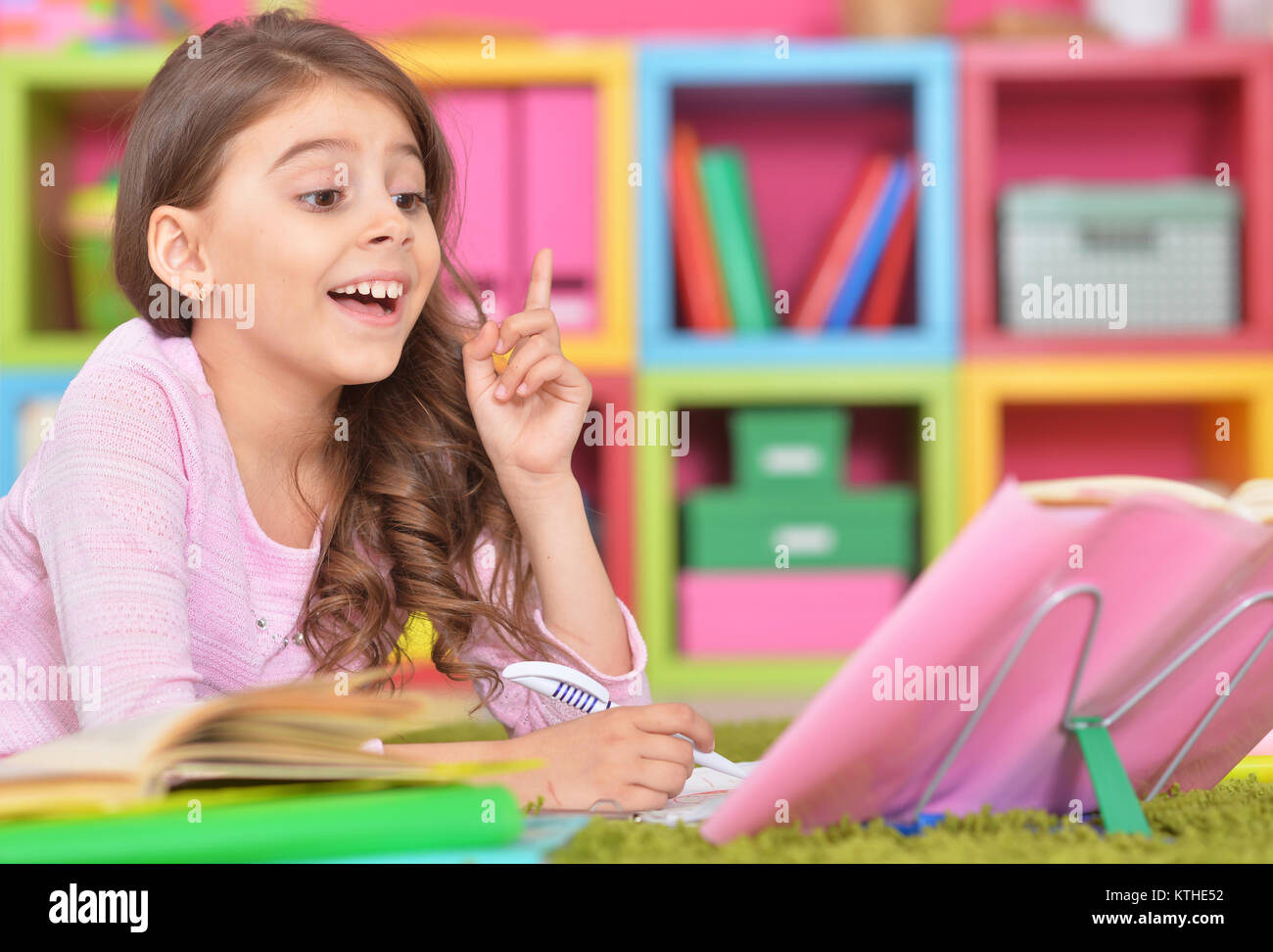 Cute schoolgirl doing homework at her room Stock Photo - Alamy