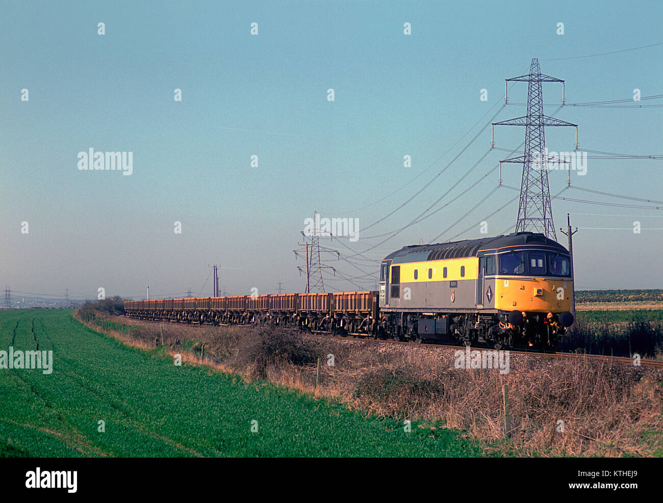 A class 33 diesel locomotive number 33025 working an empty ballast ...