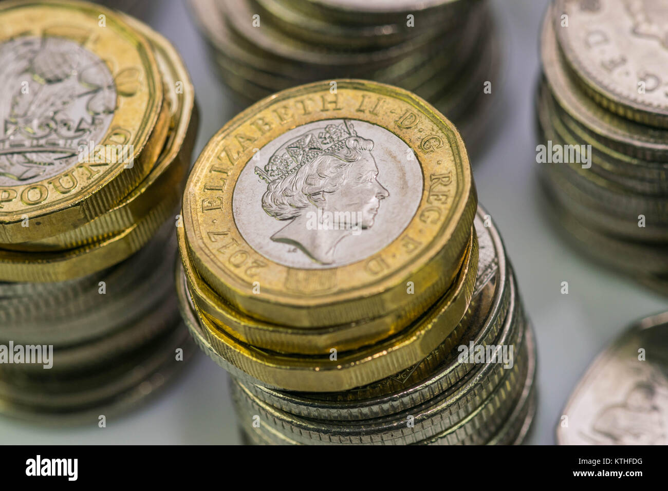 Close up focus photos of new United kingdom Pound coin, among other ...