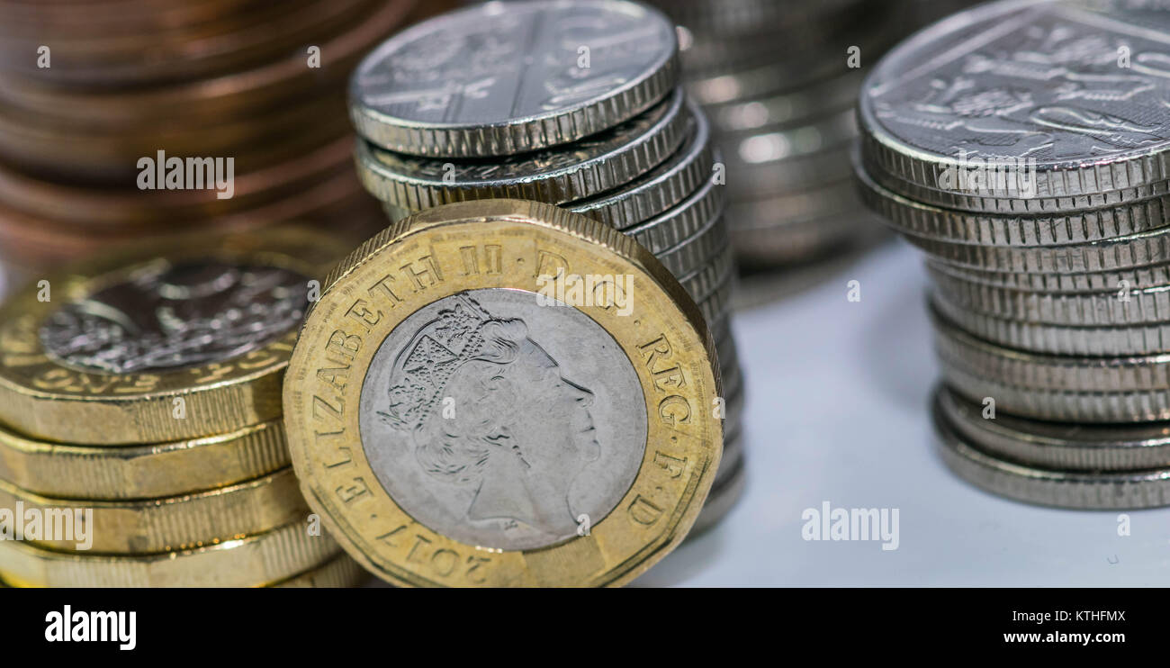 Close up focus photos of new United kingdom Pound coin, among other ...