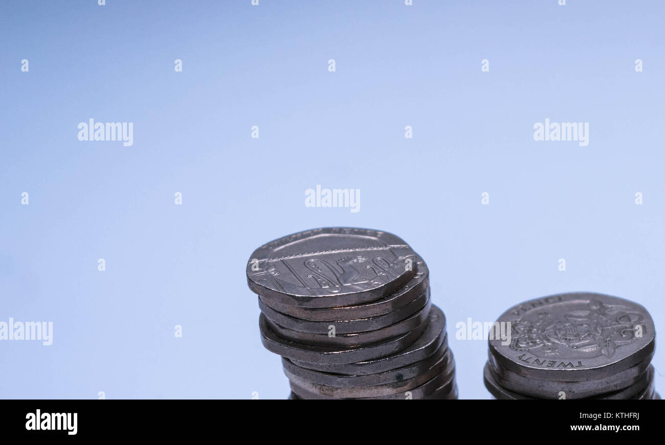 Stacks of different British coins on a white background Stock Photo - Alamy