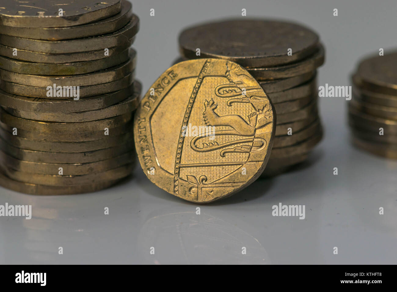 Stacks of different British coins on a white background Stock Photo - Alamy